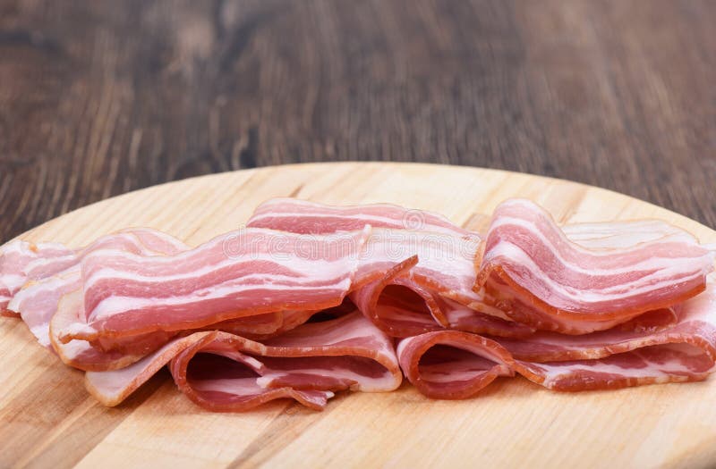 Rashers of Bacon on a Cutting Board. Close Up Stock Photo - Image of ...