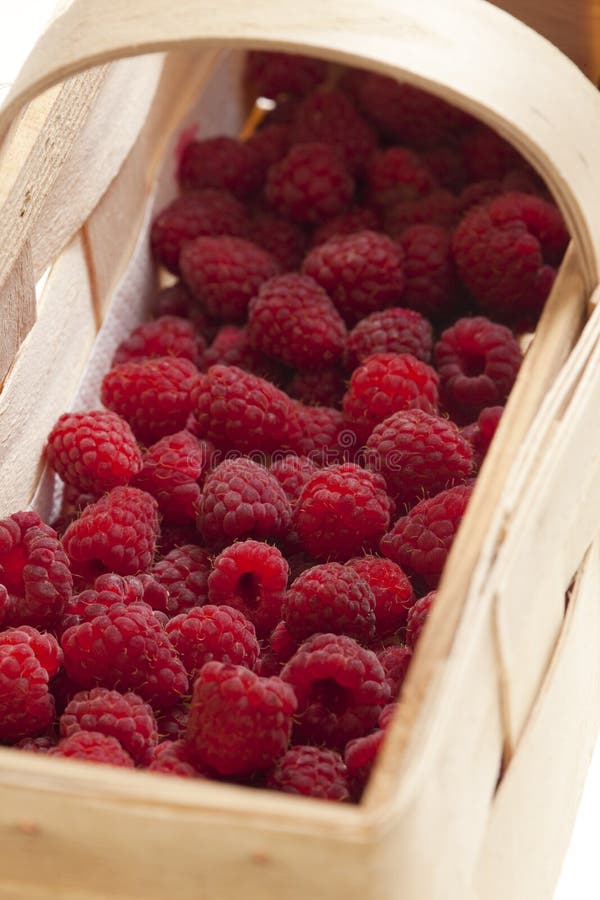 Raspberries in basket stock photo. Image of interiors - 154183954