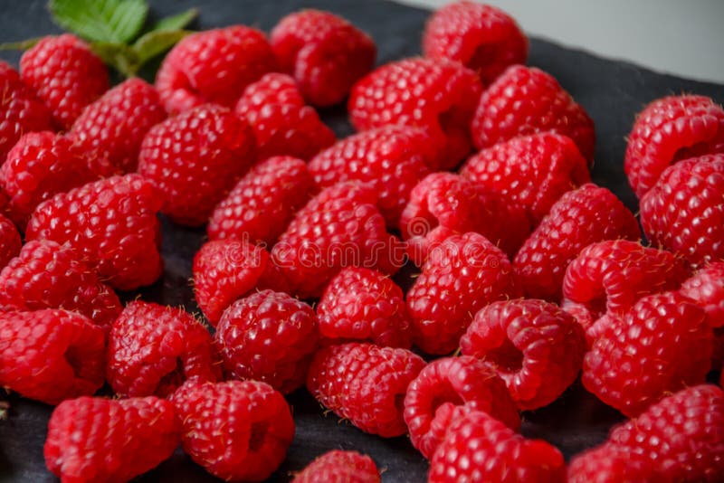 Raspberries on Black Slate Plate Stock Image - Image of fresh ...