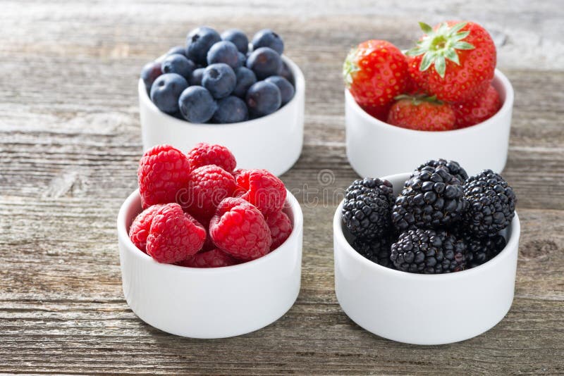 Strawberries, Blackberries, Raspberries and Blueberries in Bowls Stock ...