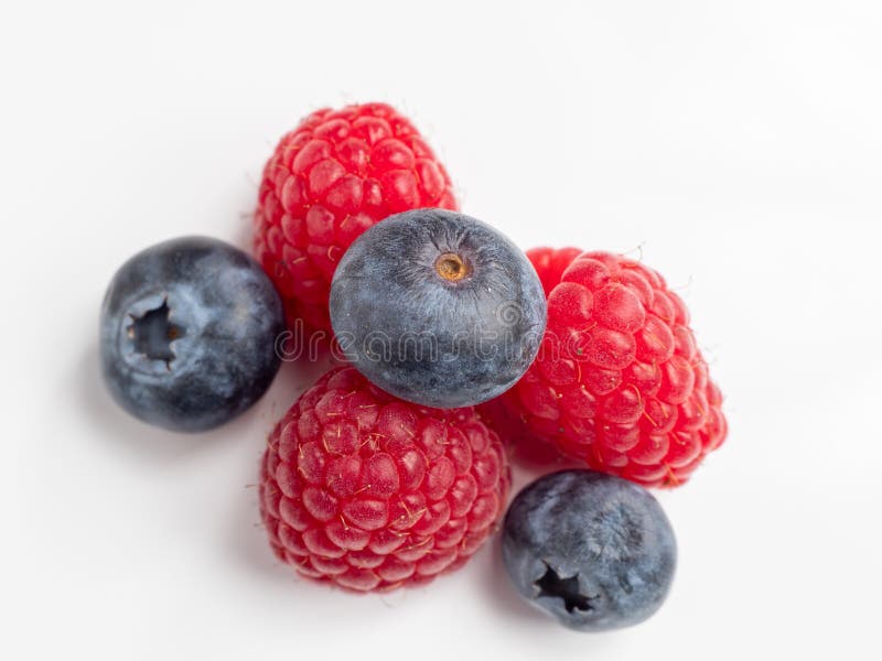 Raspberries and Blueberries on a White Background. Stock Image - Image ...