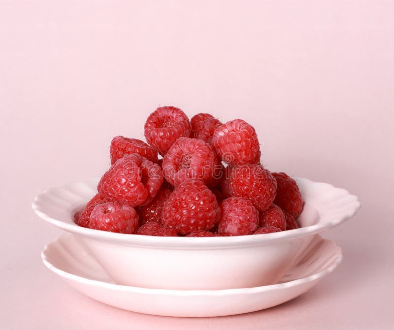 Raspberries in a bowl stock photo. Image of food, pink - 14968126
