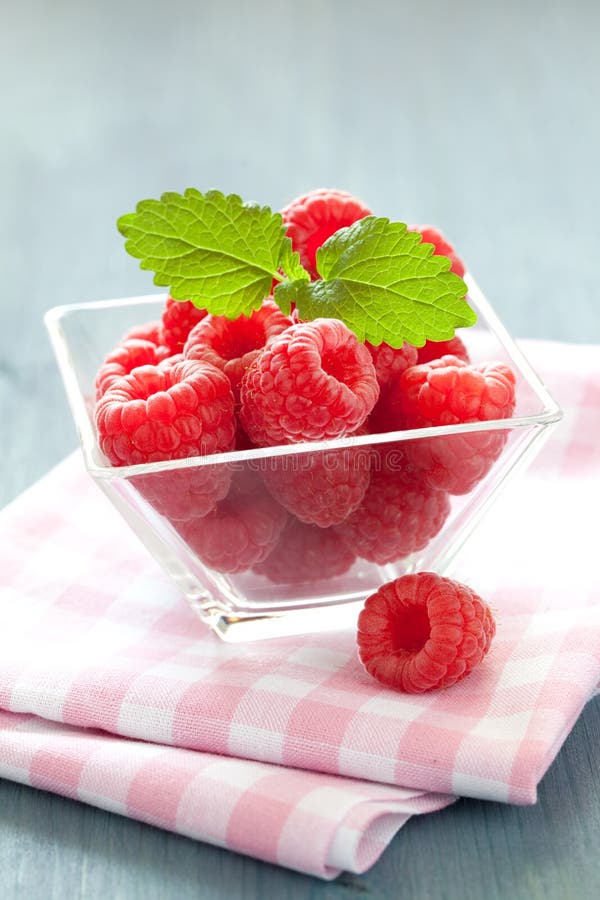 Raspberries in a bowl stock photo. Image of raspberries - 19402228
