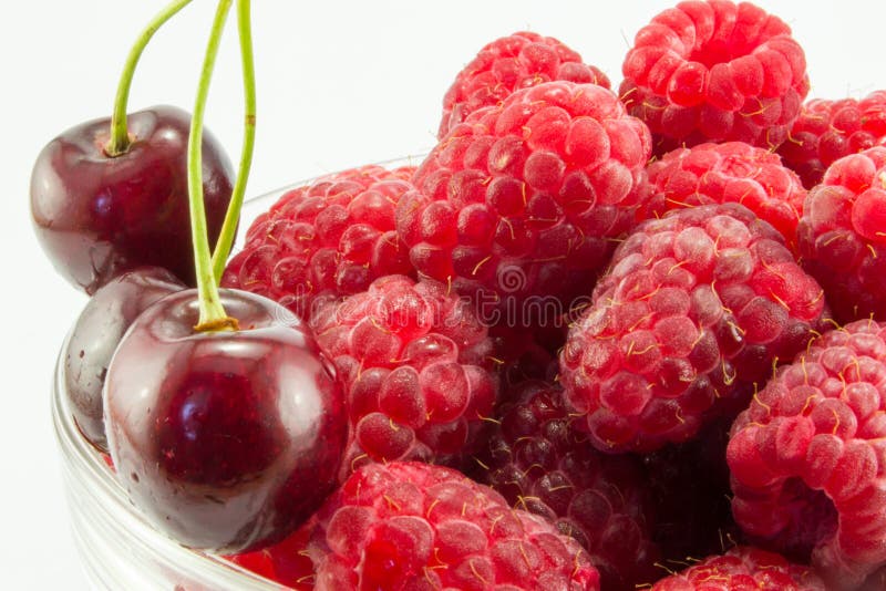 Raspberries with cherries stock image. Image of food - 84323915