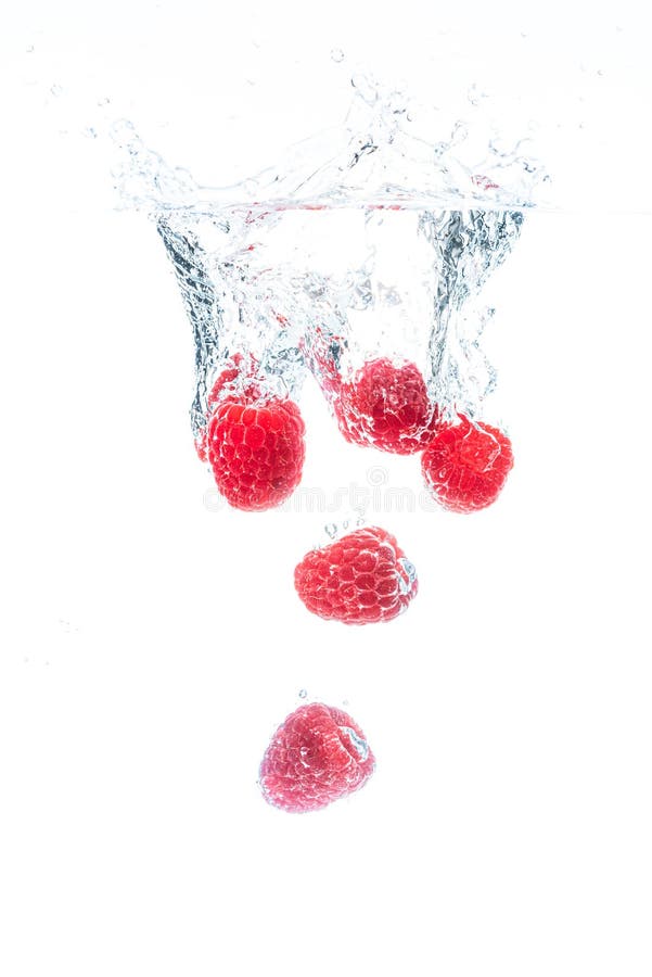 Red Raspberries Dropped into Water with Splash Stock Photo - Image of ...