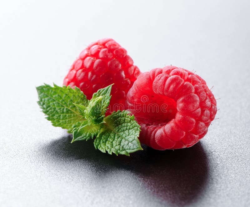 Raspberries with Mint Leaves on Black Background Stock Photo - Image of ...