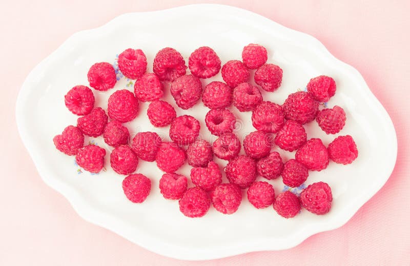 Raspberries in a plate stock image. Image of riped, healthy - 32459997