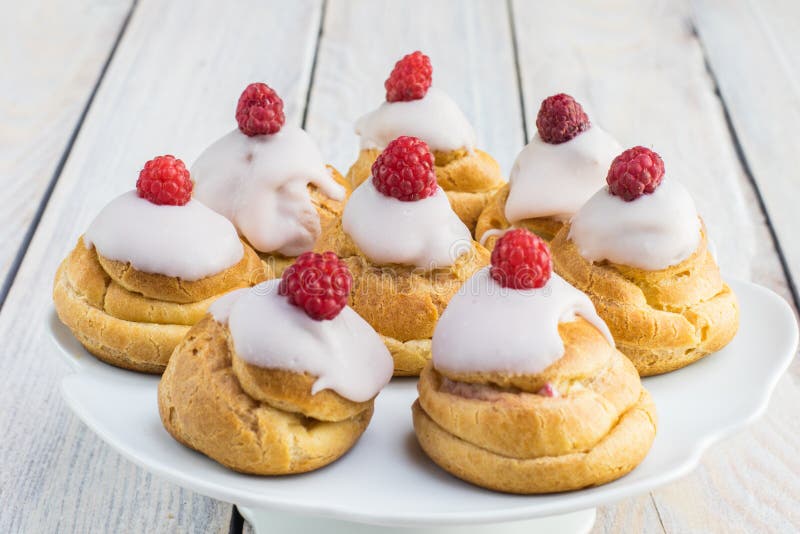 Raspberries Profiterole with White Chocolate on Plate Stock Image ...