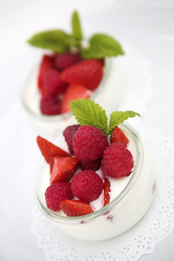 Raspberries and Strawberries Stock Photo - Image of diagonal, cream ...