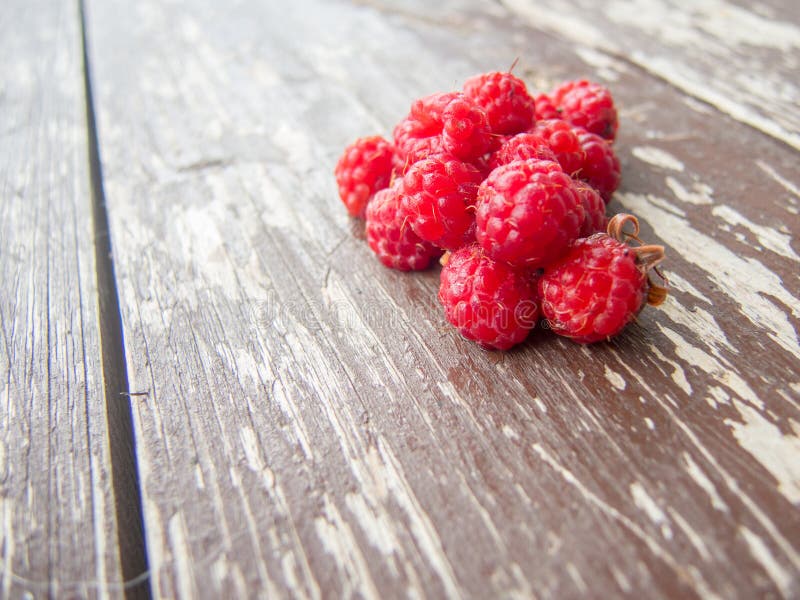 Raspberries on wood boards stock photo. Image of raspberries - 57500398