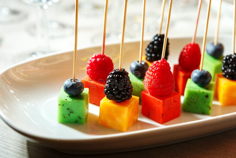 Raspberry, BlackBerry, Blueberry and Colored Cheese Canapes Stock Photo ...