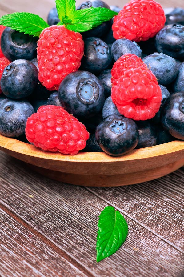 Raspberry and blueberry stock photo. Image of mint, bowl - 32799170