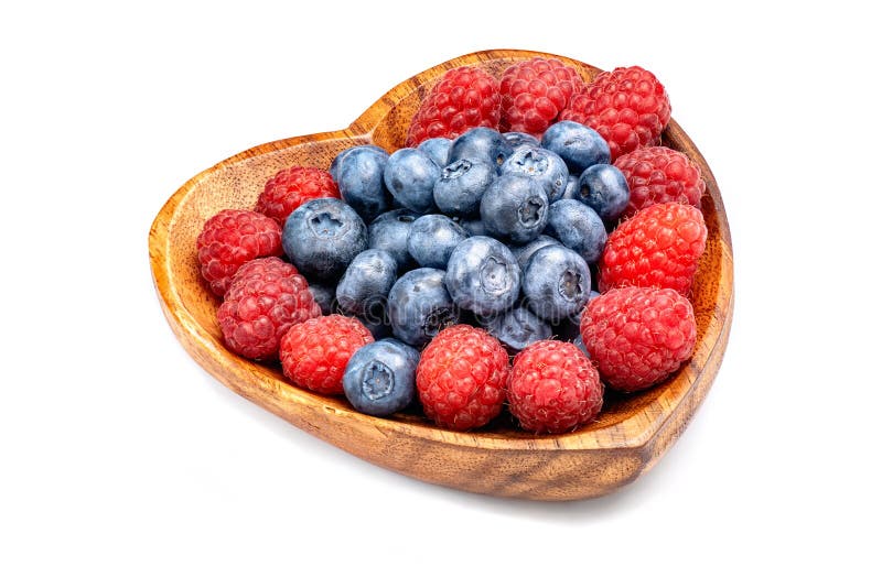 Raspberry and Blueberry in Wooden Bowl in the Shape of Heart Isolated ...