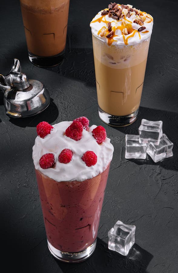 Raspberry, Caramel and Chocolate Cocktails on Stone Table Stock Photo ...