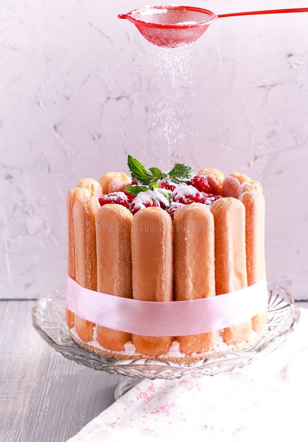 Raspberry Charlotte Cake with Icing Sugar Sifting Stock Image - Image ...