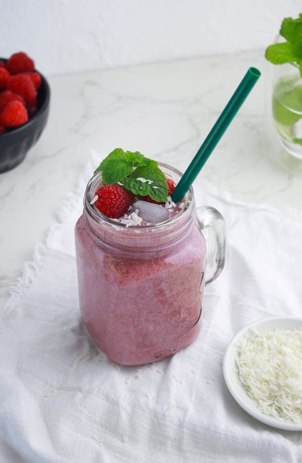 Raspberry Coconut Smoothie with Ice in a Jar with Straw, White ...