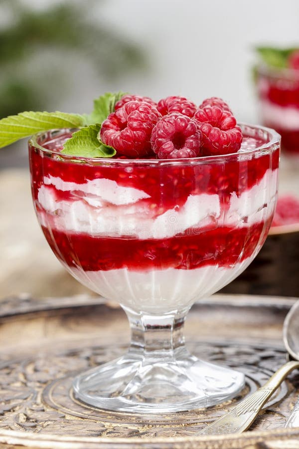 Raspberry Dessert on Wooden Table Stock Image - Image of colorful ...