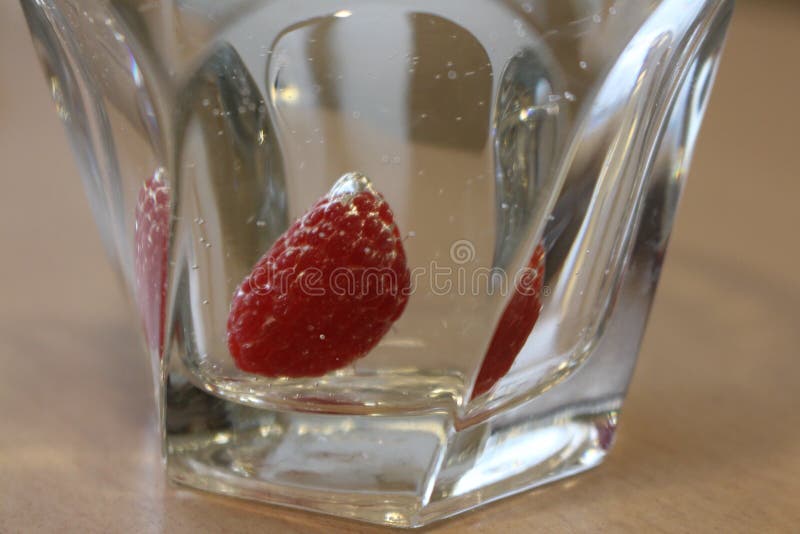 Raspberry in a Faceted Glass Stock Photo - Image of food, delicious ...