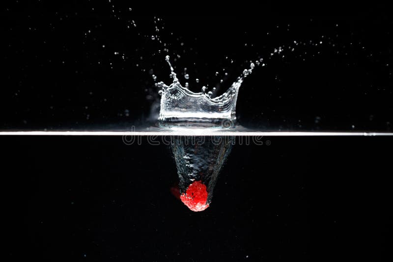 Raspberry Falls Deeply Under Water with a Big Splash. Stock Photo ...