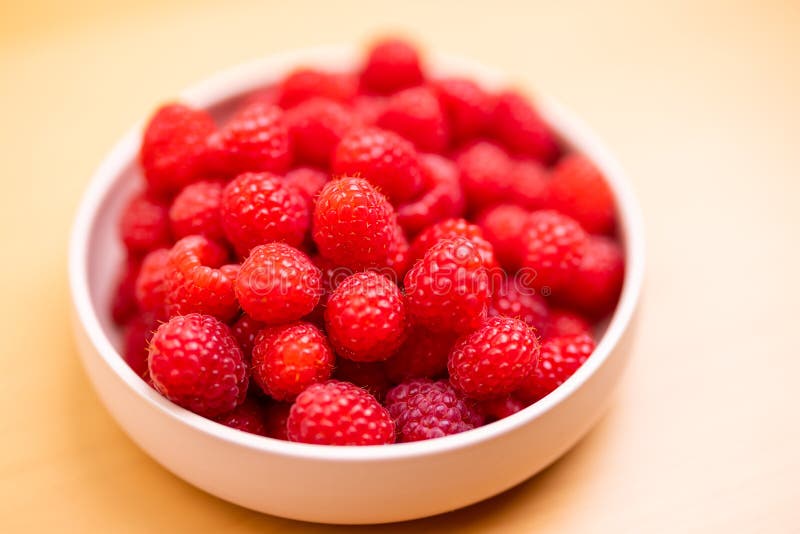 Raspberry fruit on bowl stock image. Image of natural - 258575493