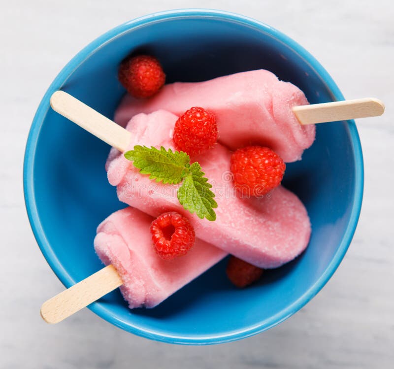 Raspberry Ice Cream Popsicles in Blue Bowls. Stock Photo - Image of ...