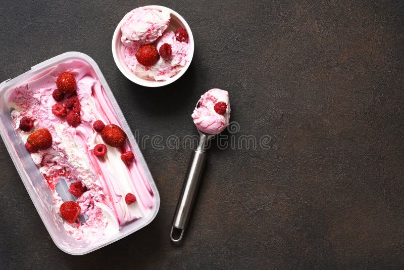 Raspberry Ice Cream with Strawberries on a Concrete Background Stock ...
