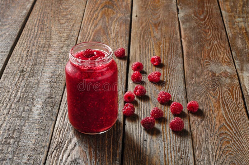 Raspberry Jam in Glass Jar with Berry on Rustic Wood Table Stock Photo ...