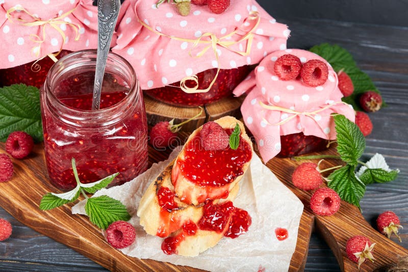 Raspberry Jam in Jars and Toasts with Jam Stock Photo - Image of food ...