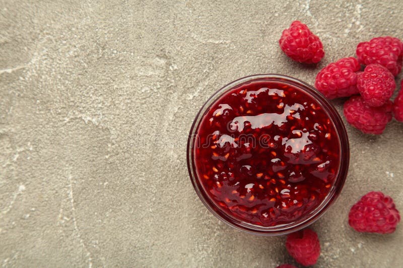 Raspberry Jam Jelly in Bowl with Berries on Grey Concrete Background ...