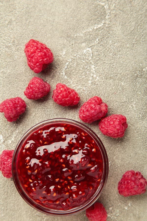 Raspberry Jam Jelly in Bowl with Berries on Grey Concrete Background ...