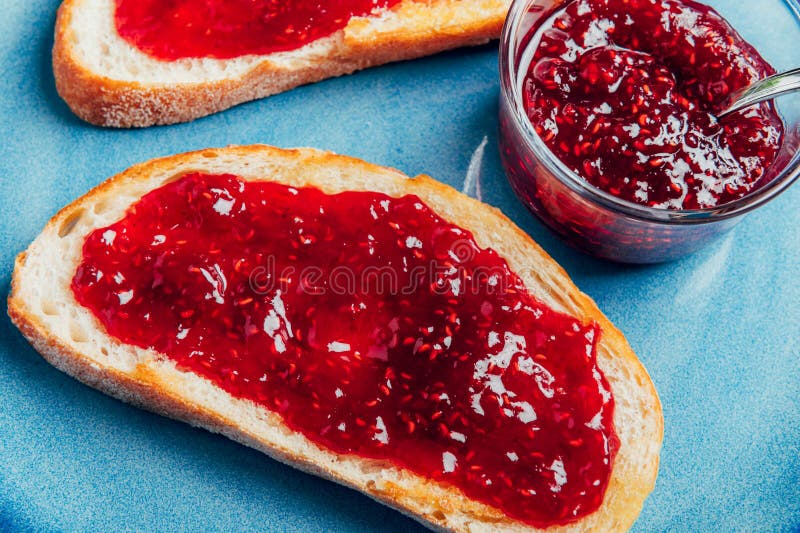 Raspberry jam on toast stock photo. Image of mint, slice - 270086046