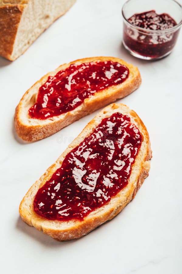 Raspberry jam on toast stock image. Image of berry, casein - 270303093