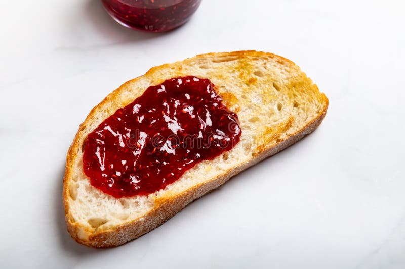 Raspberry jam on toast stock photo. Image of tasty, traditional - 268145546