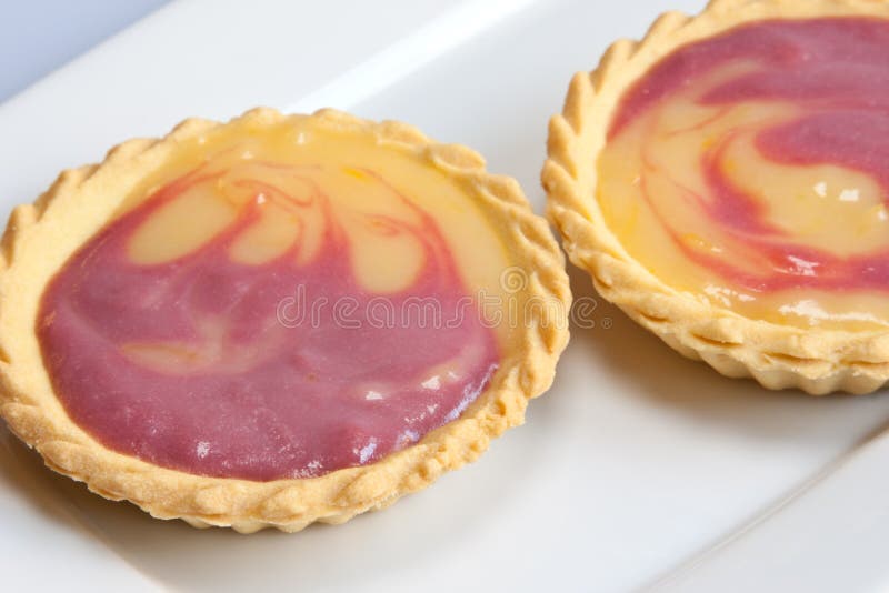 Raspberry & Lemon Curd Tarts Stock Photo - Image of berries, spiral ...