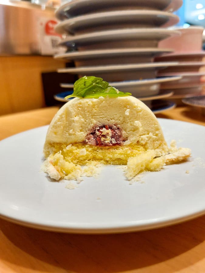 Raspberry Mousse Cut in Half on White Plate Stock Photo - Image of ...