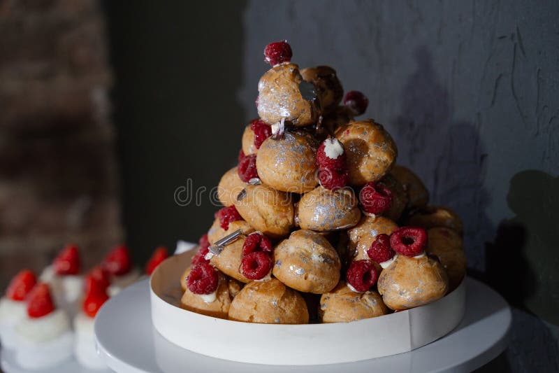Raspberry Profiteroles in the Form of a Slide with Edible Silverware on ...