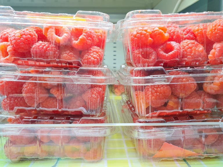 Raspberry in the punnet stock photo. Image of wooden - 310298360