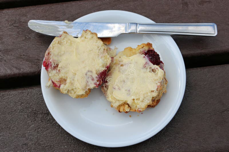 Raspberry scone on plate stock photo. Image of knife - 139320454
