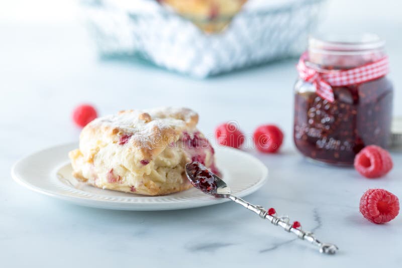 Raspberry Scone with Raspberry Jam on a Spoon and a Jar of Raspberry ...