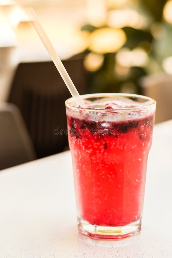 Raspberry and Sprite Lemonade with Ice Cubes in a Glass Stock Photo ...