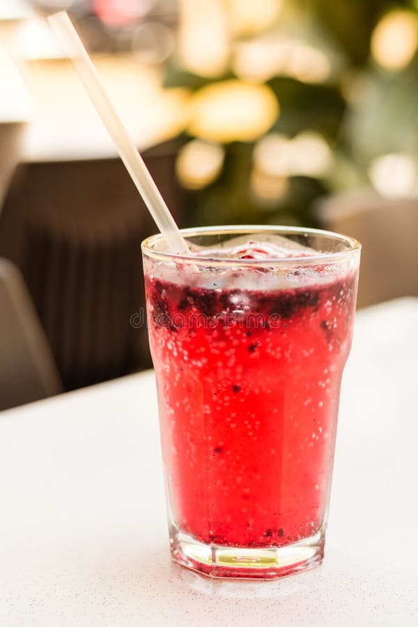 Raspberry and Sprite Lemonade with Ice Cubes in a Glass Stock Photo ...