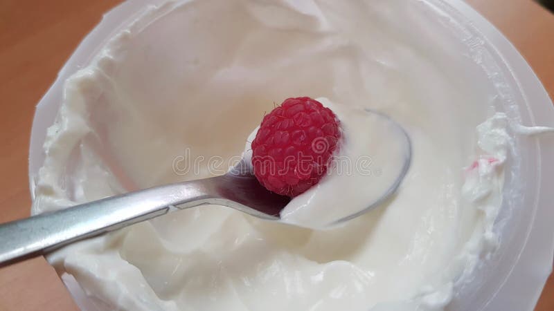 Raspberry in a yogurt stock image. Image of healthy - 136010961