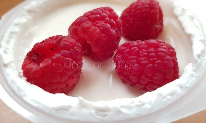 Raspberry in a yogurt stock photo. Image of milk, nutrition - 136010974
