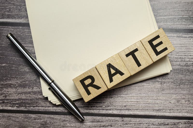 Rate Word Written in Wooden Cubes on Notebook with Pen Stock Image ...