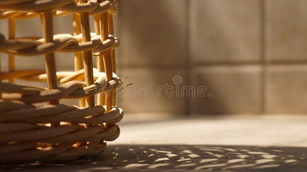 A Rattan Basket with Sunlight Reflection Stock Photo - Image of furniture, glass: 290999738