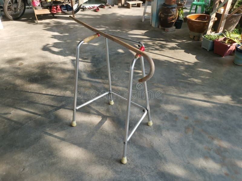 Rattan Walking Stick and Stainless Metal Walker Stock Photo - Image of ...