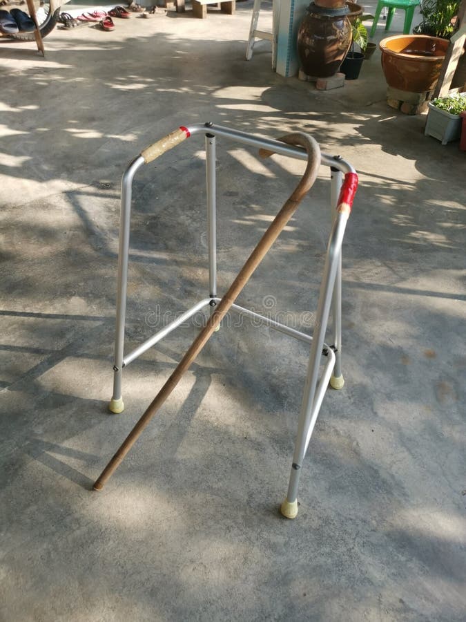 Rattan Walking Stick and Stainless Metal Walker Stock Image - Image of ...