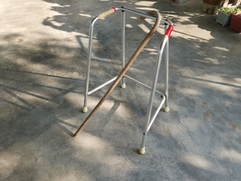 Rattan Walking Stick and Stainless Metal Walker Stock Image - Image of ...