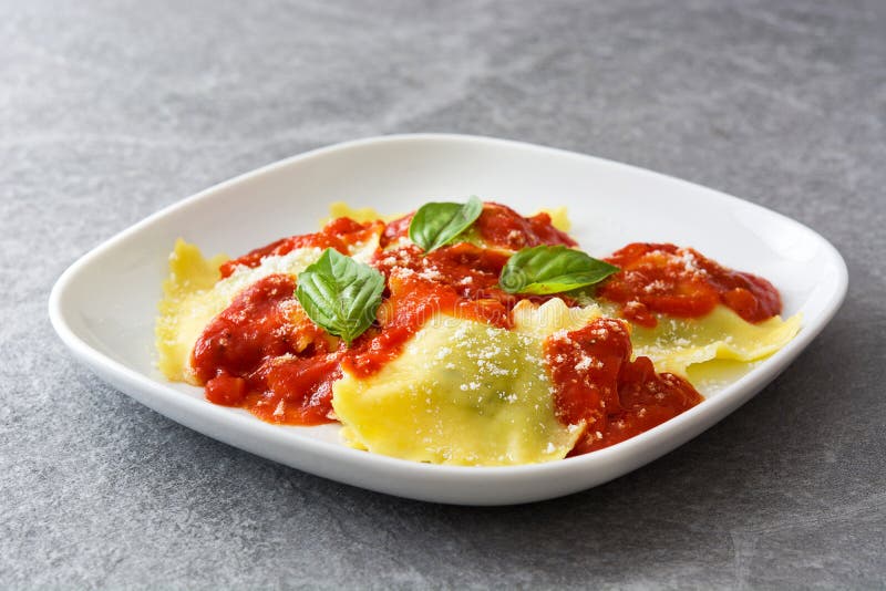 Ravioli with Tomato Sauce and Basil on Gray Stone Stock Photo - Image ...