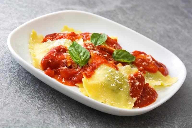 Ravioli with Tomato Sauce and Basil on Gray Stone Stock Image - Image ...